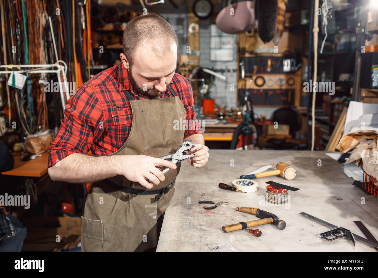 Working process in the leather workshop. Tanner in old tannery Stock ...