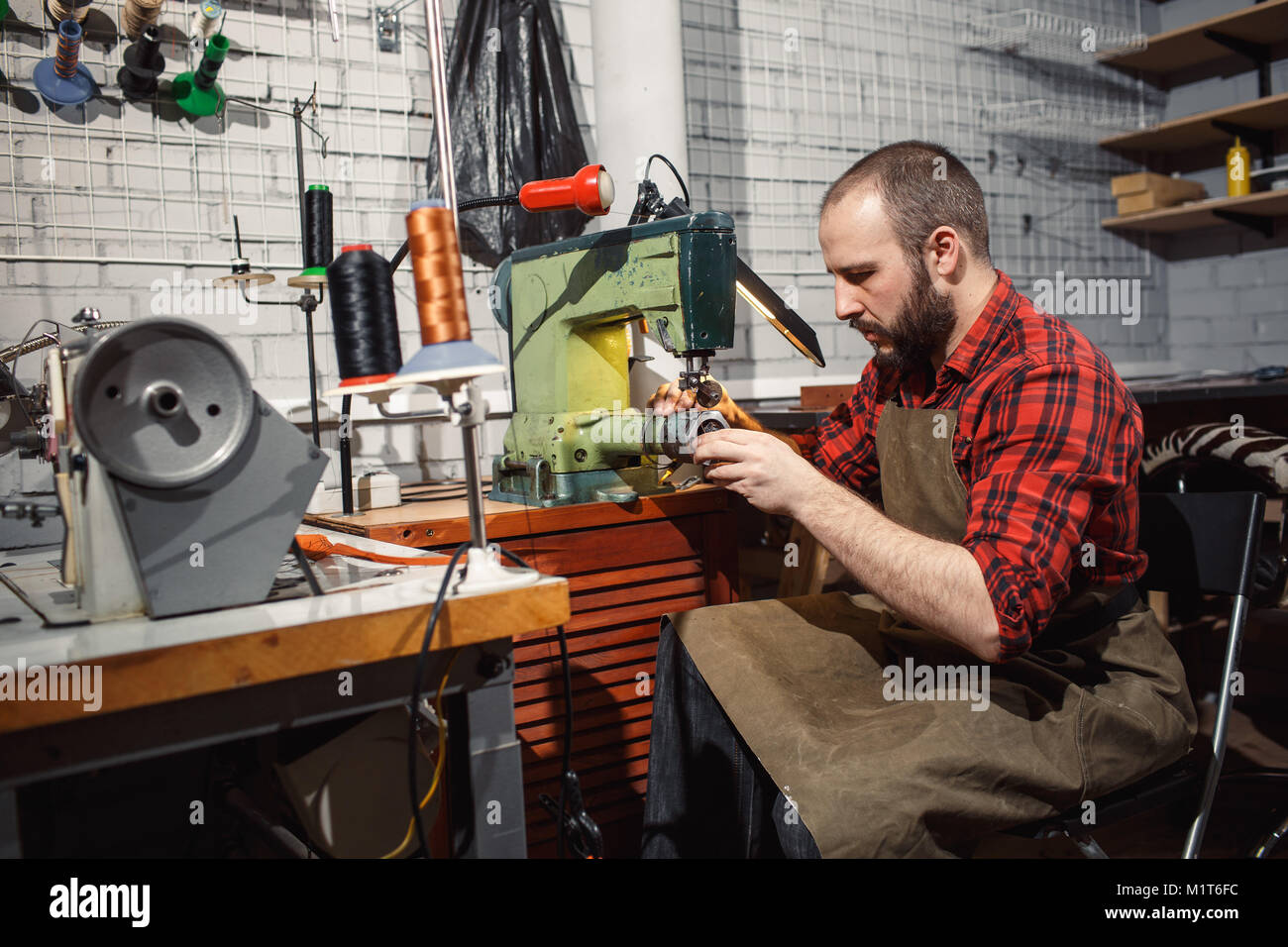 Working process in the leather workshop. Tanner in old tannery Stock ...