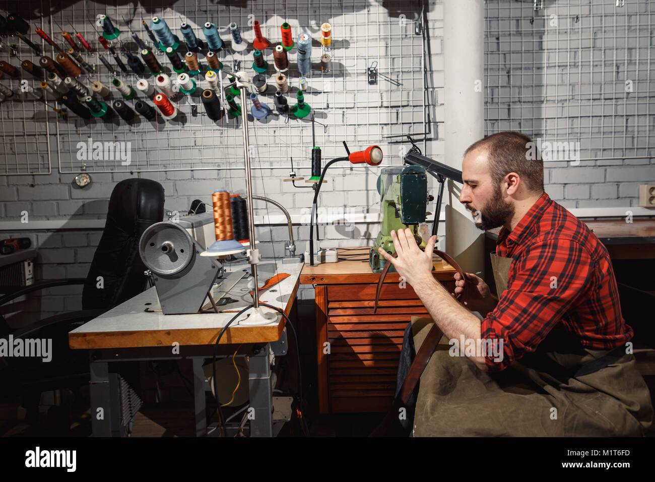 Working process in the leather workshop. Tanner in old tannery Stock ...