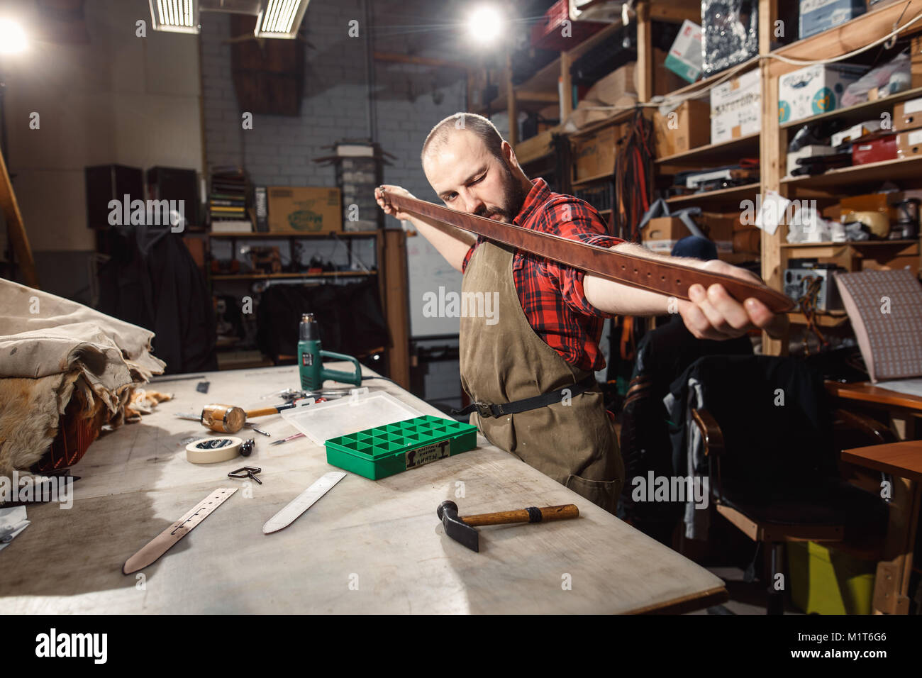 Working process in the leather workshop. Tanner in old tannery Stock ...