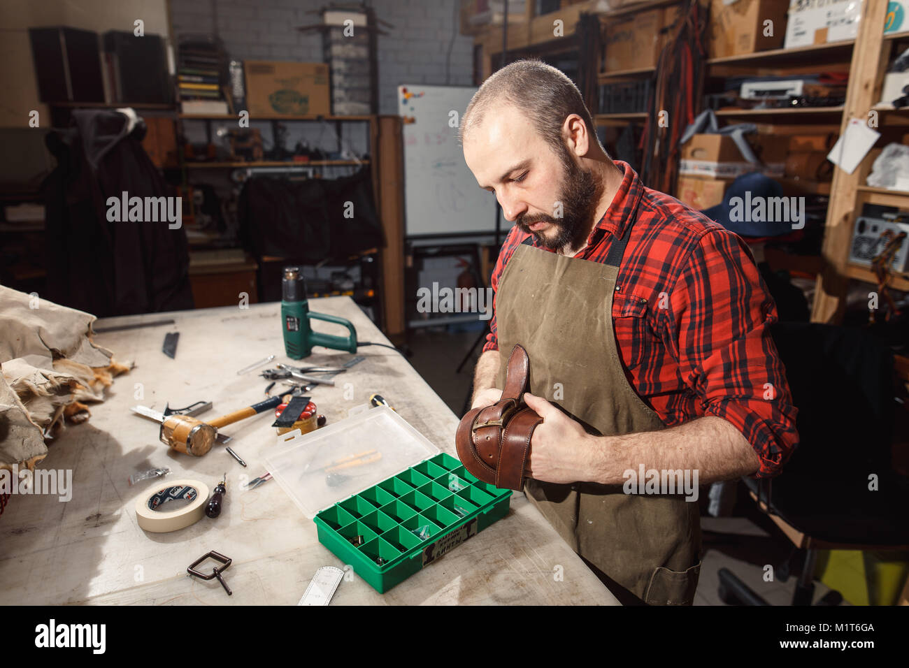Working process in the leather workshop. Tanner in old tannery Stock ...