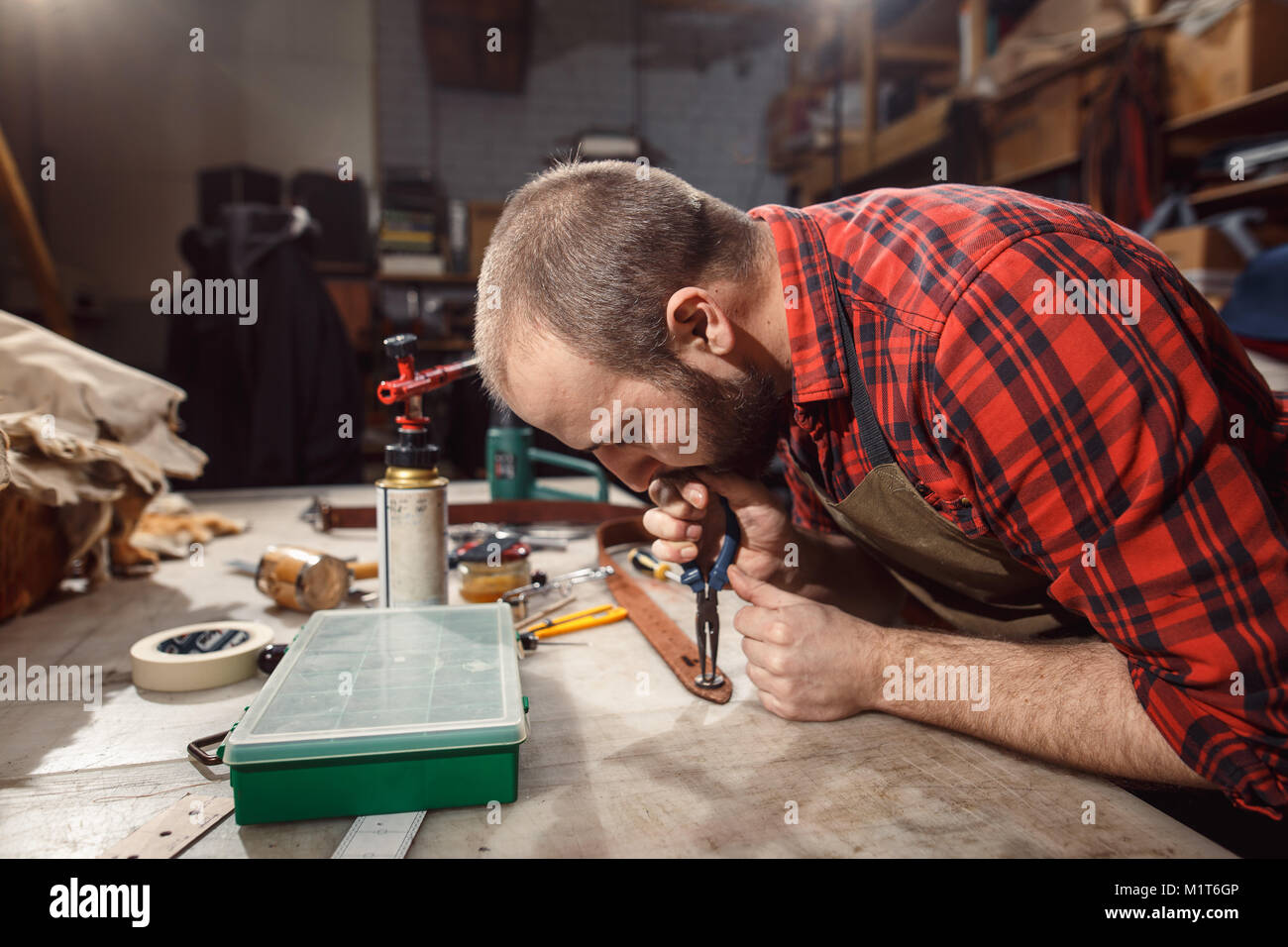 Working process in the leather workshop. Tanner in old tannery Stock ...