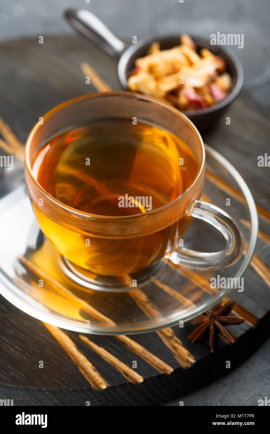 Cup of hot apple tea with spices Stock Photo - Alamy