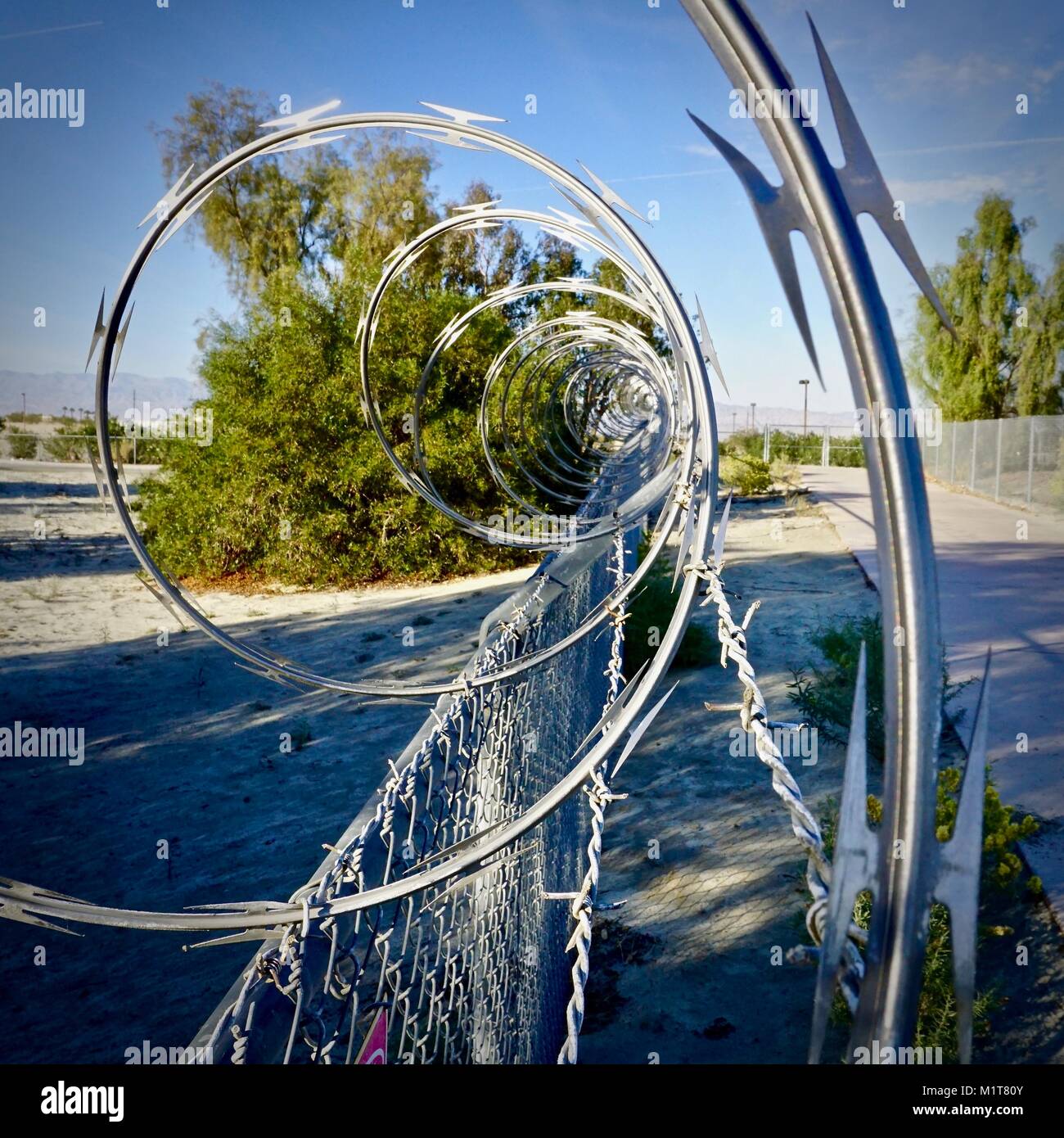 Steel razor wire perimeter fence hi-res stock photography and images ...