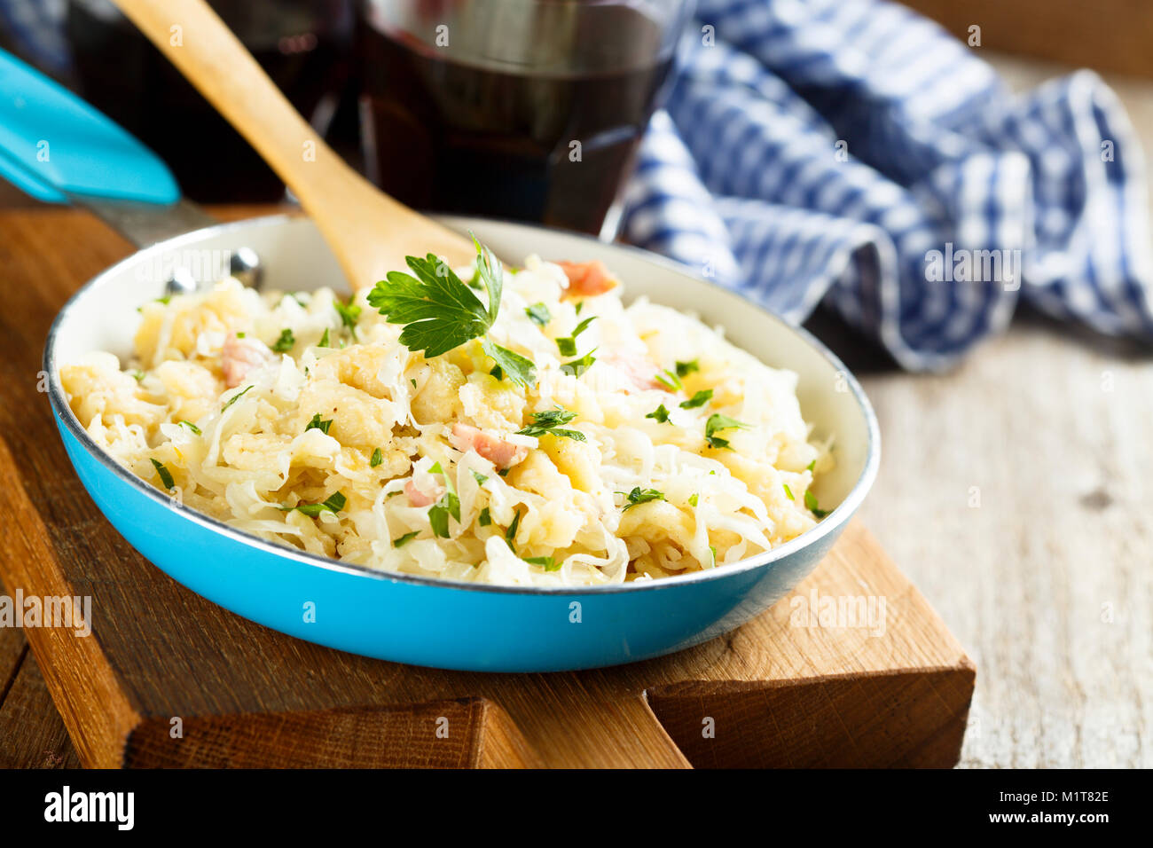 Sauerkraut stew with fresh spaetzle pasta Stock Photo - Alamy