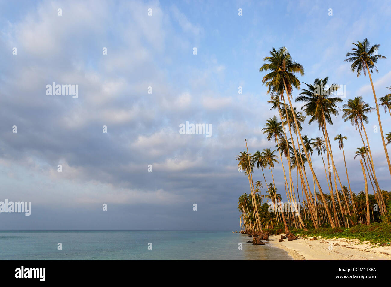 Beautiful tropical beach at sunset and stormy skies, Banyak Archipelago ...
