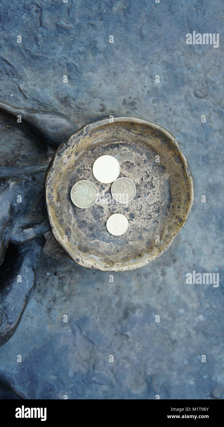 coins of money for homeless man Stock Photo - Alamy