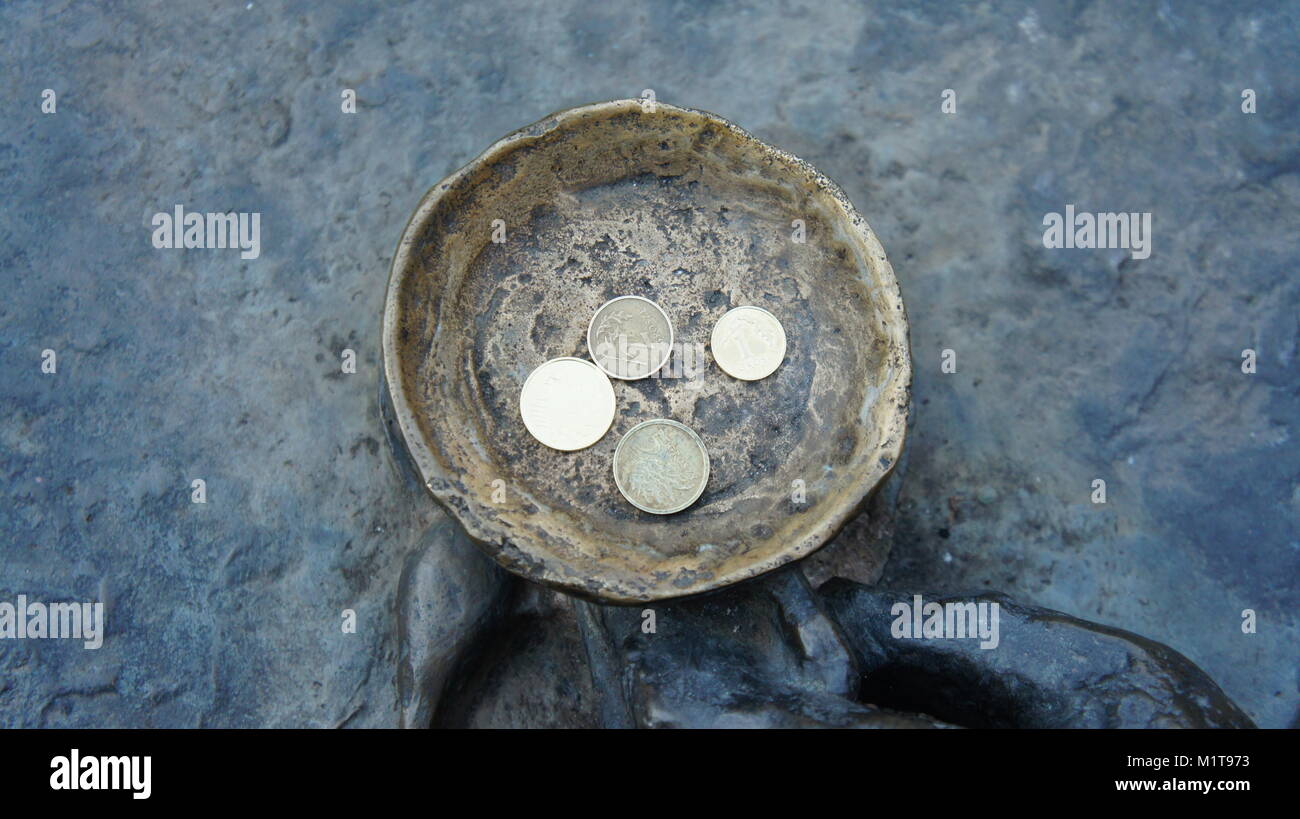 coins of money for homeless man Stock Photo - Alamy