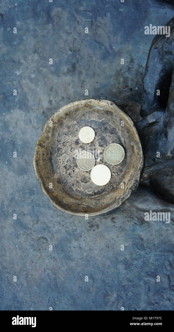 coins of money for homeless man Stock Photo - Alamy