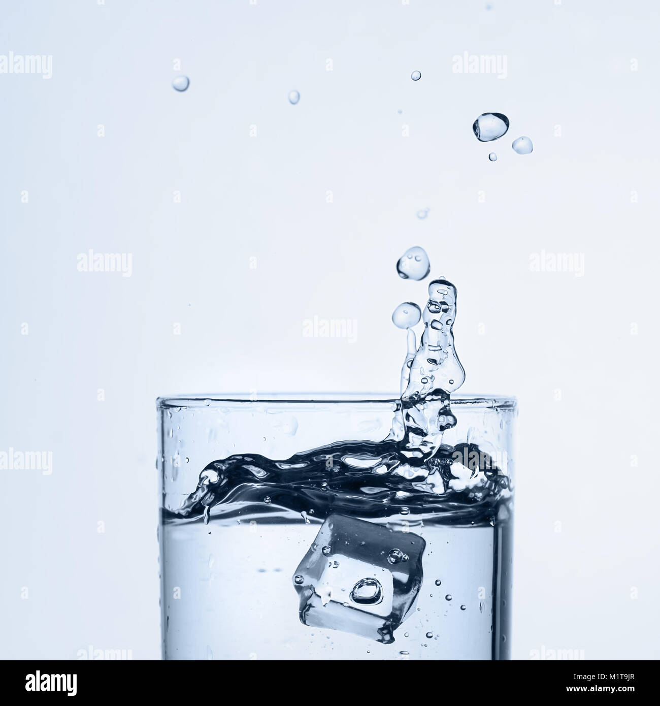 Water splash in the glass of pure water. Macro photography Stock Photo ...