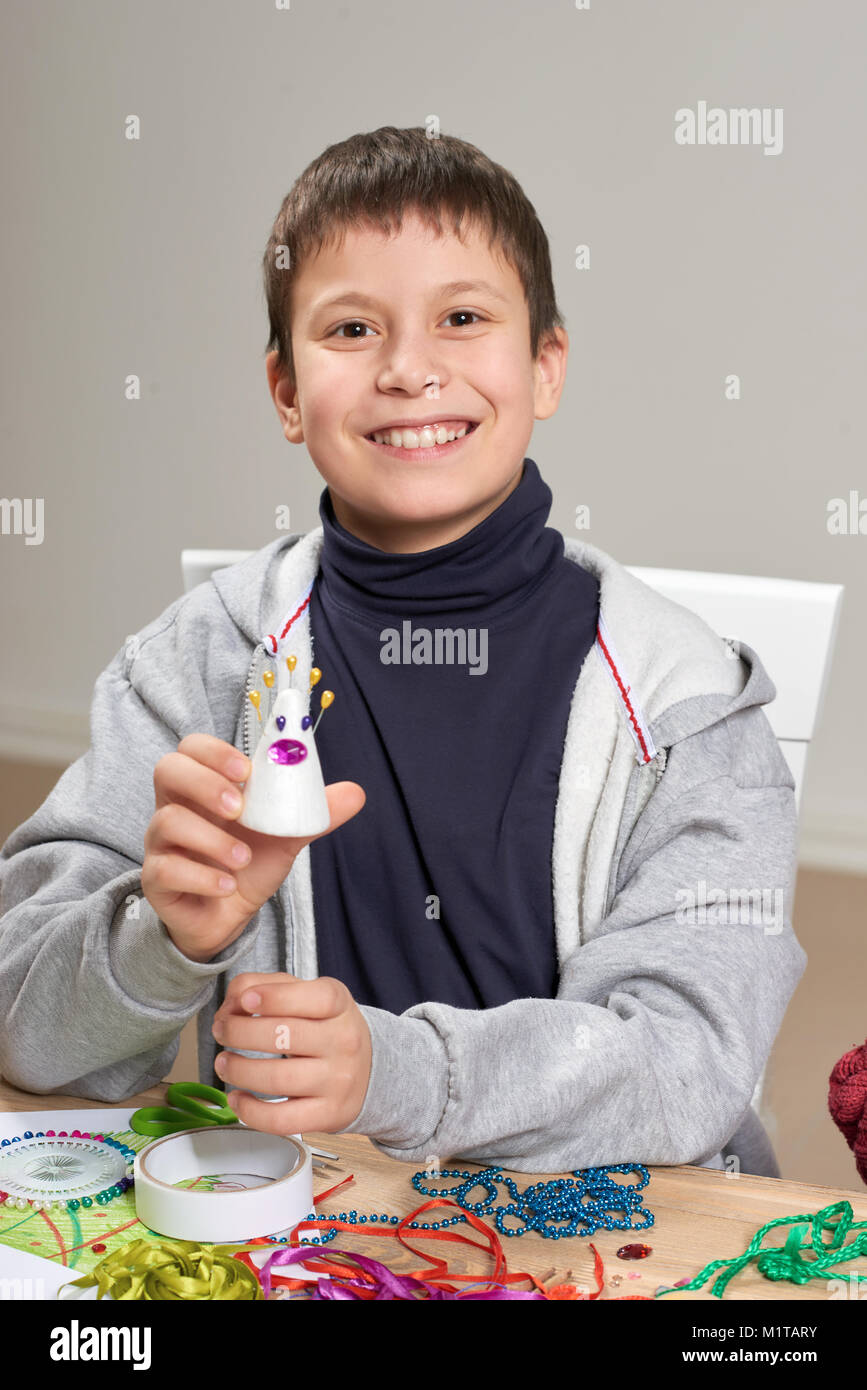 Children make crafts and toys, handmade concept. Artwork workplace with ...