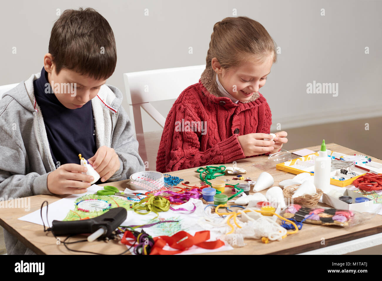 Children make crafts and toys, handmade concept. Artwork workplace with ...