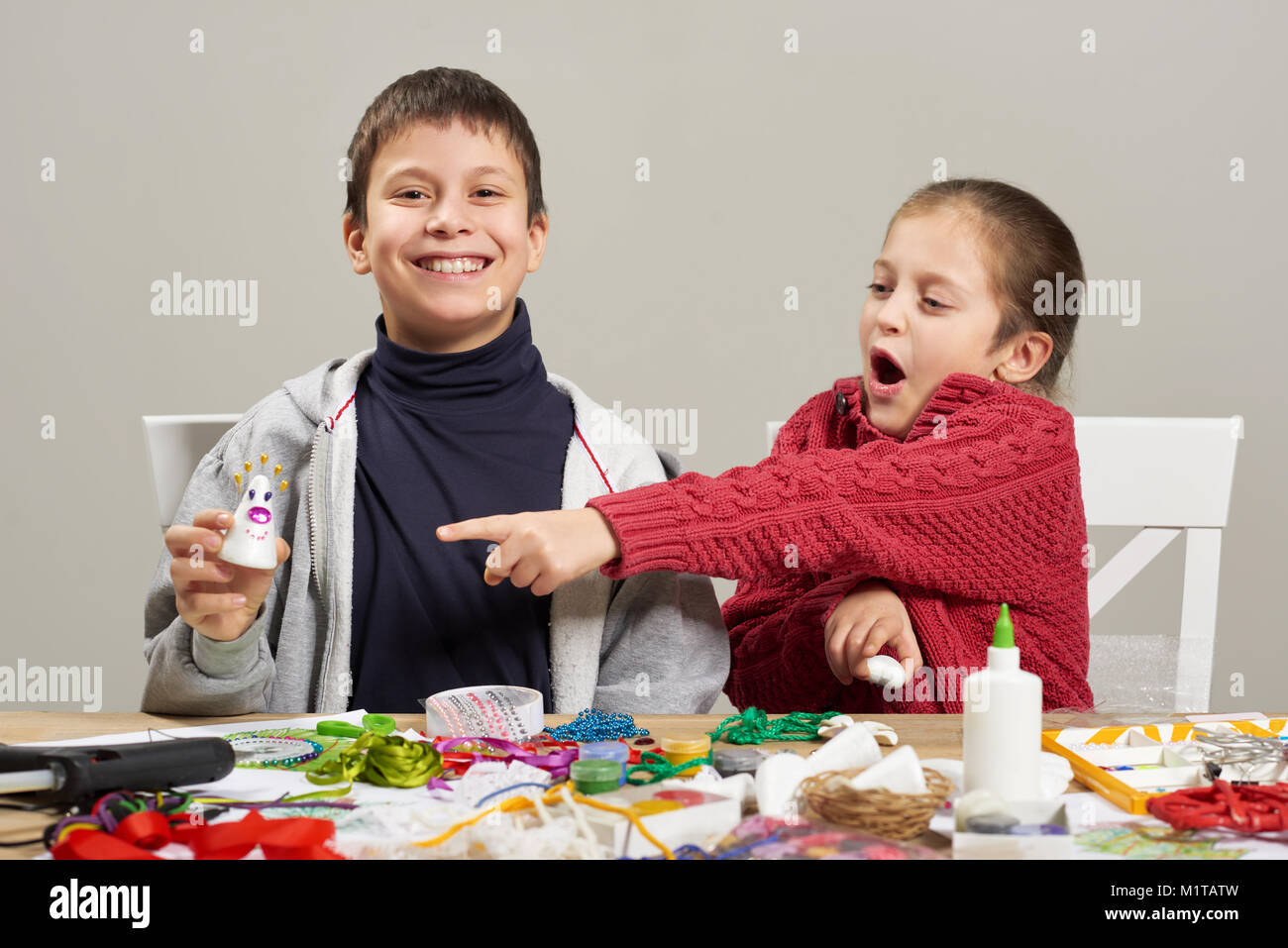 Children make crafts and toys, handmade concept. Artwork workplace with ...