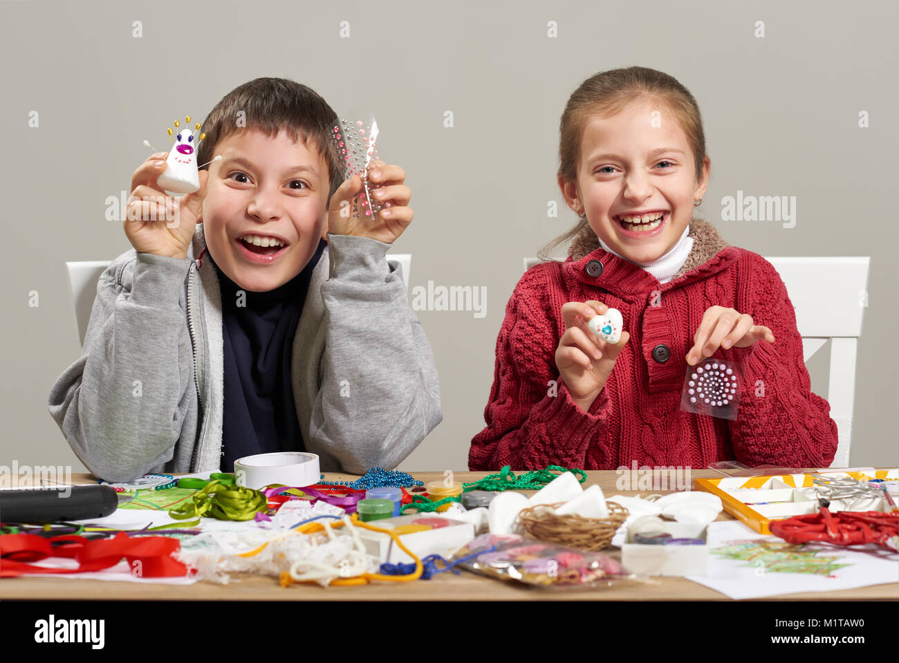 Children make crafts and toys, handmade concept. Artwork workplace with ...