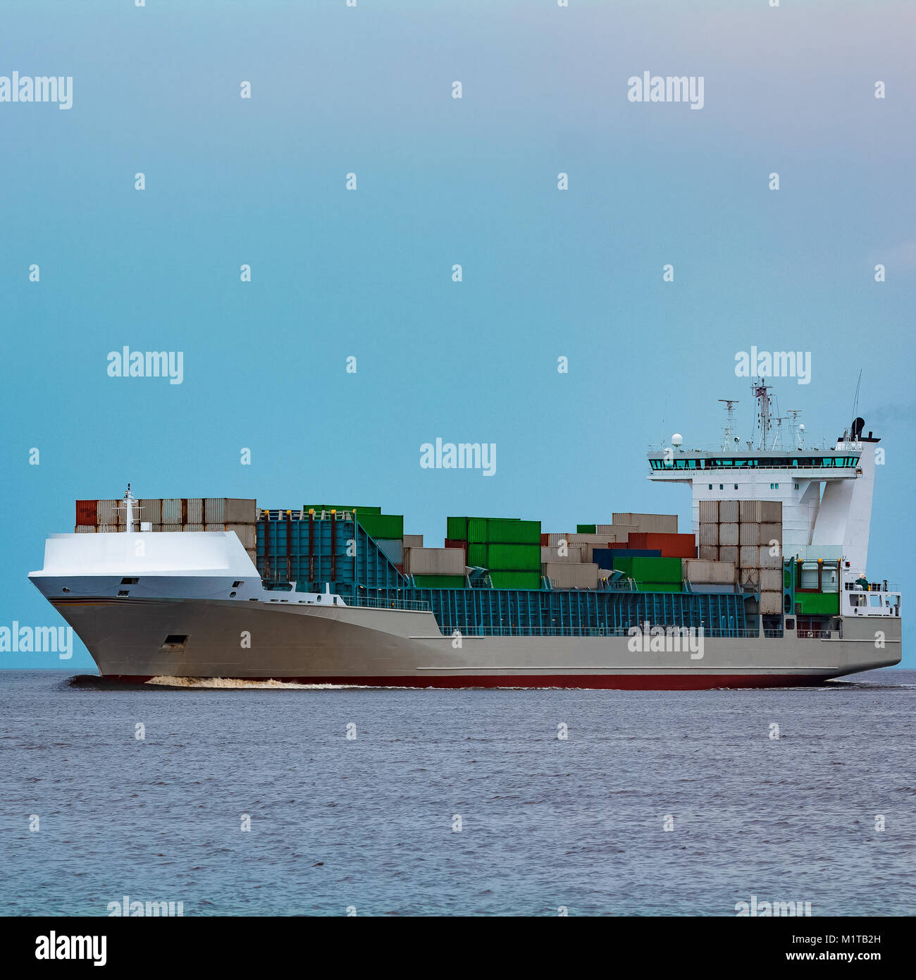 Grey container ship. Logistics and production import Stock Photo - Alamy