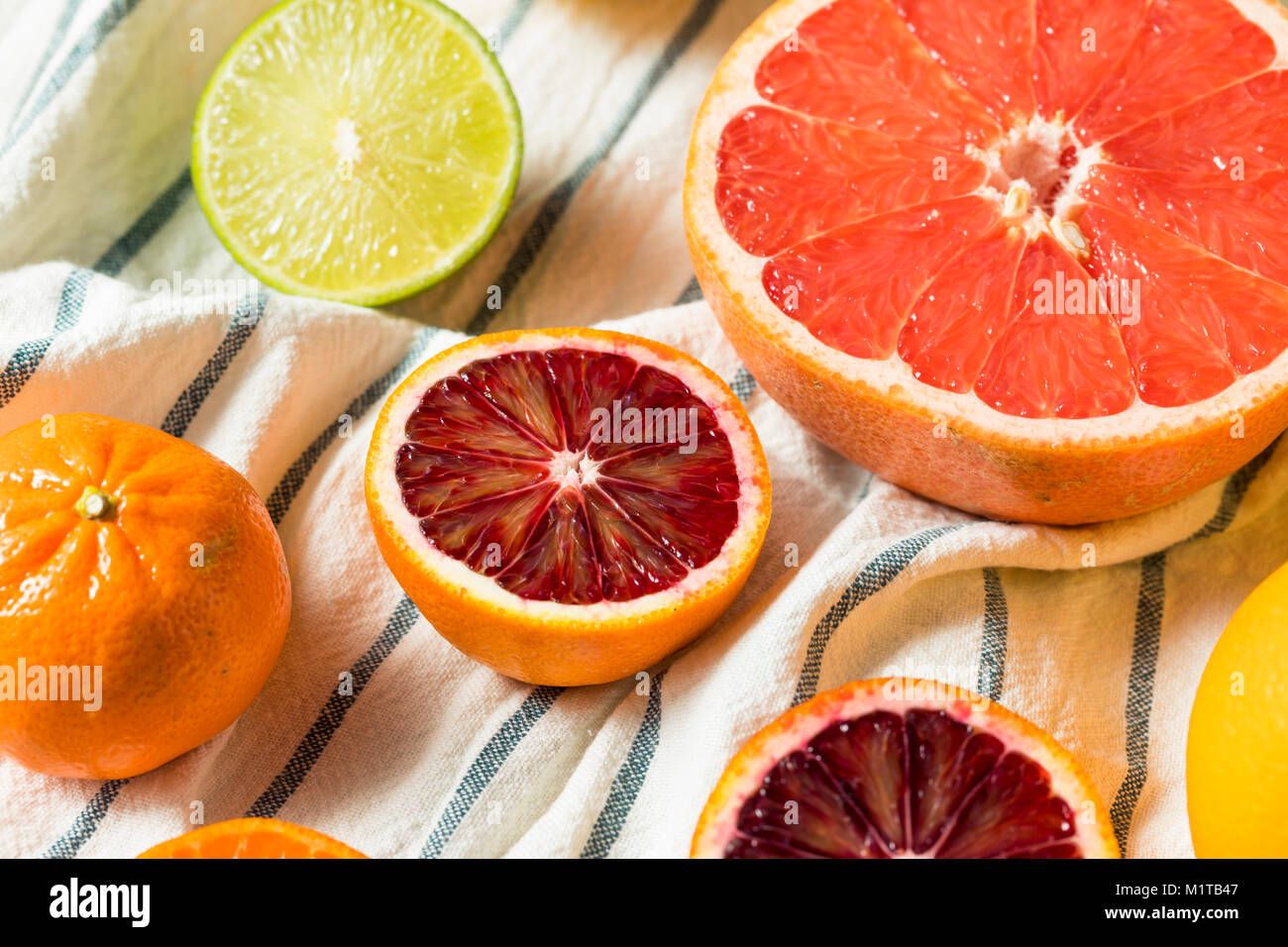 Assorted Raw Organic Citrus Fruit with Oranges Limes Lemons Grapefruit ...