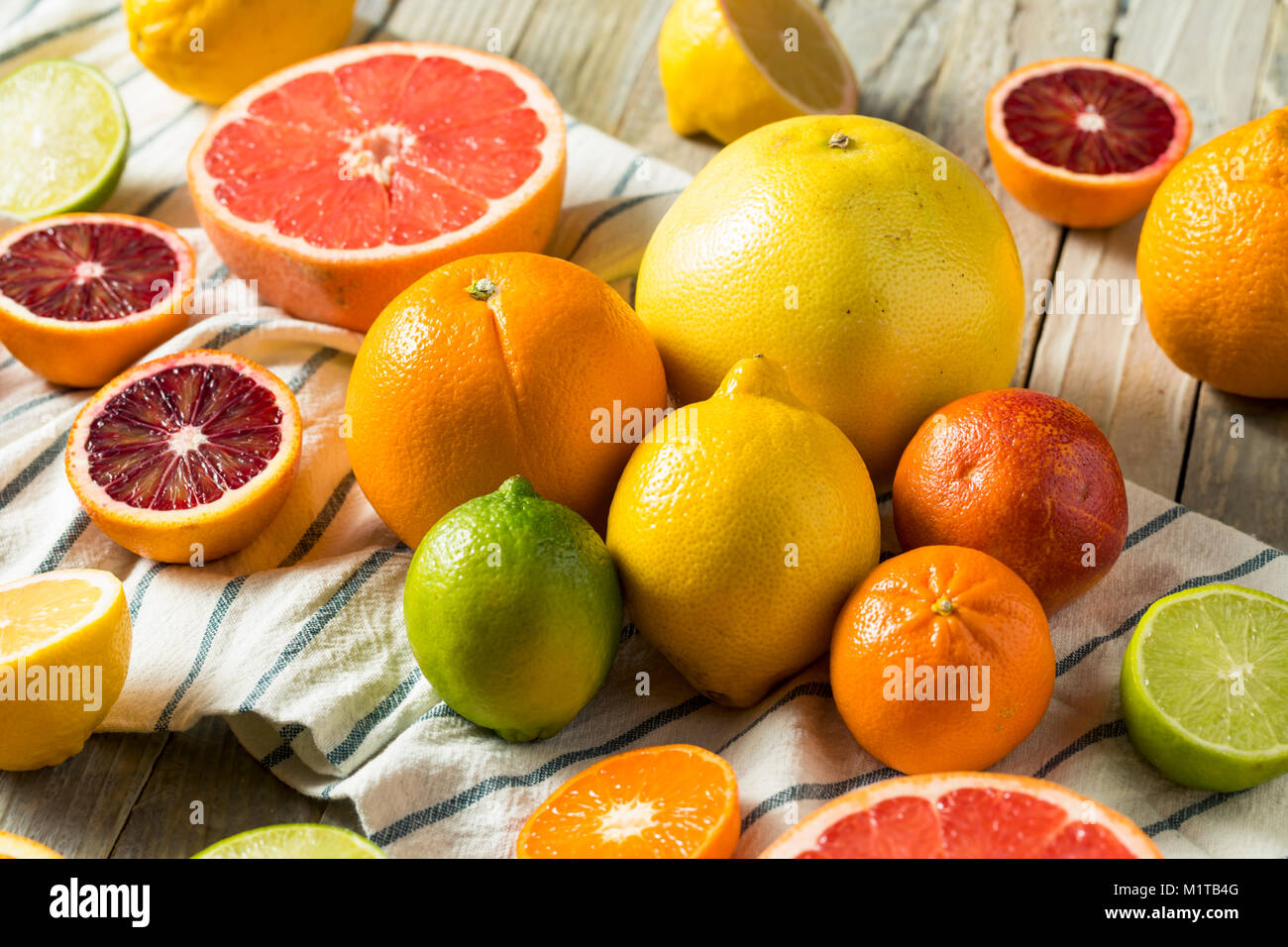 Assorted Raw Organic Citrus Fruit with Oranges Limes Lemons Grapefruit ...
