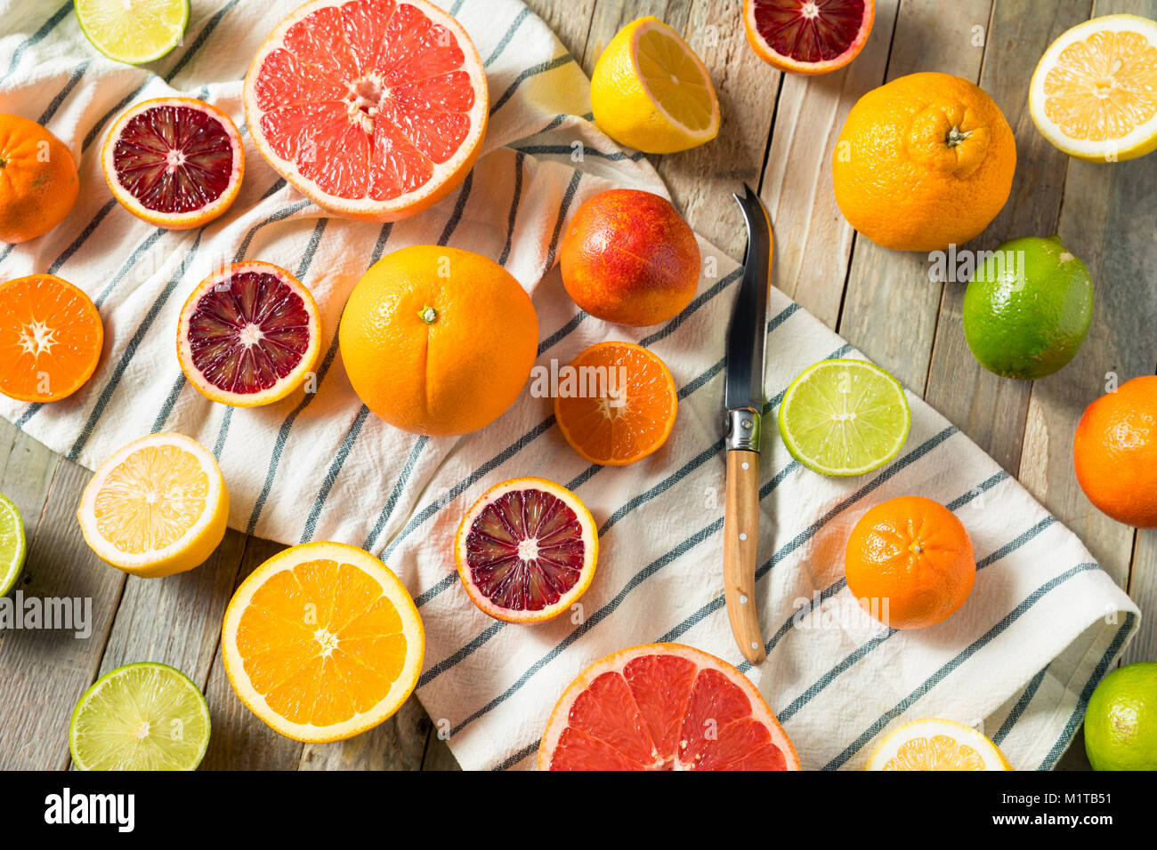 Assorted Raw Organic Citrus Fruit with Oranges Limes Lemons Grapefruit ...