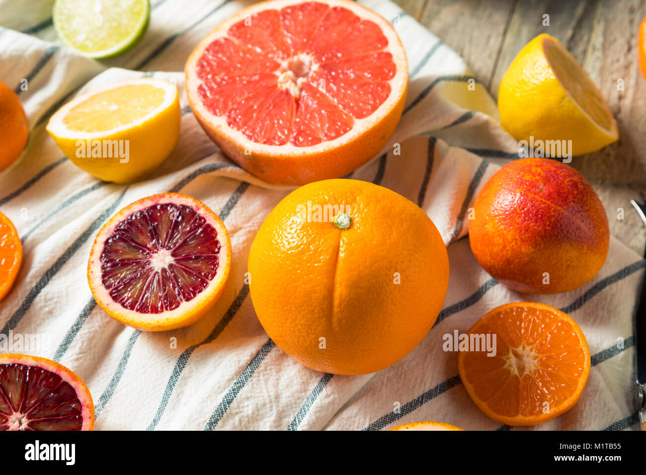 Assorted Raw Organic Citrus Fruit with Oranges Limes Lemons Grapefruit ...