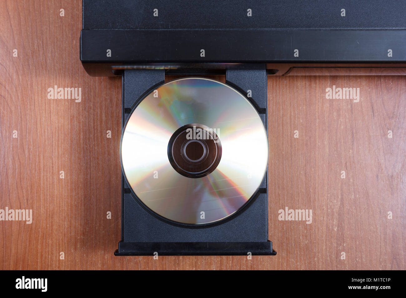 cd in retro cd player opened tray on brown table Stock Photo - Alamy