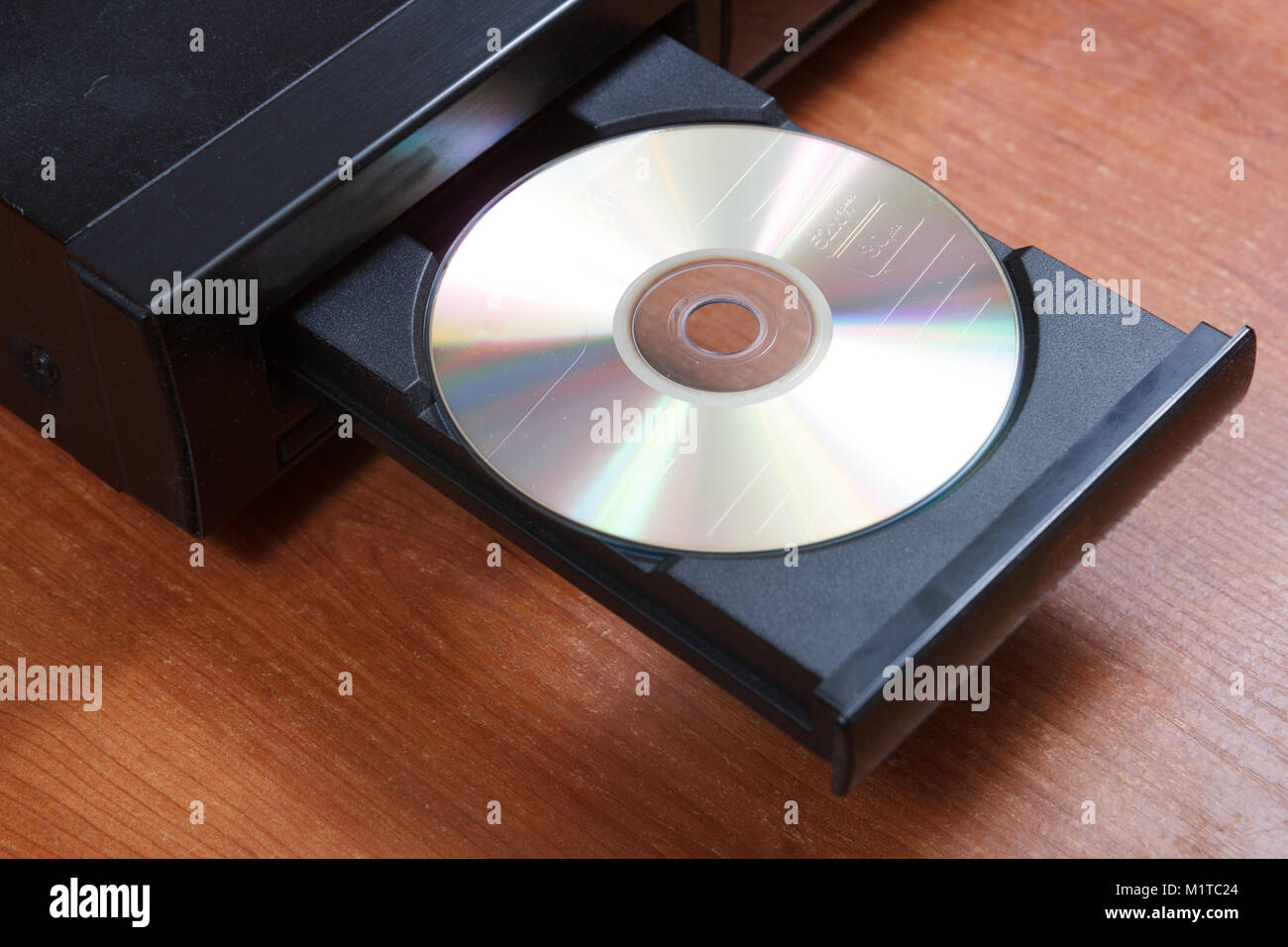 cd in retro cd player opened tray on brown table Stock Photo - Alamy