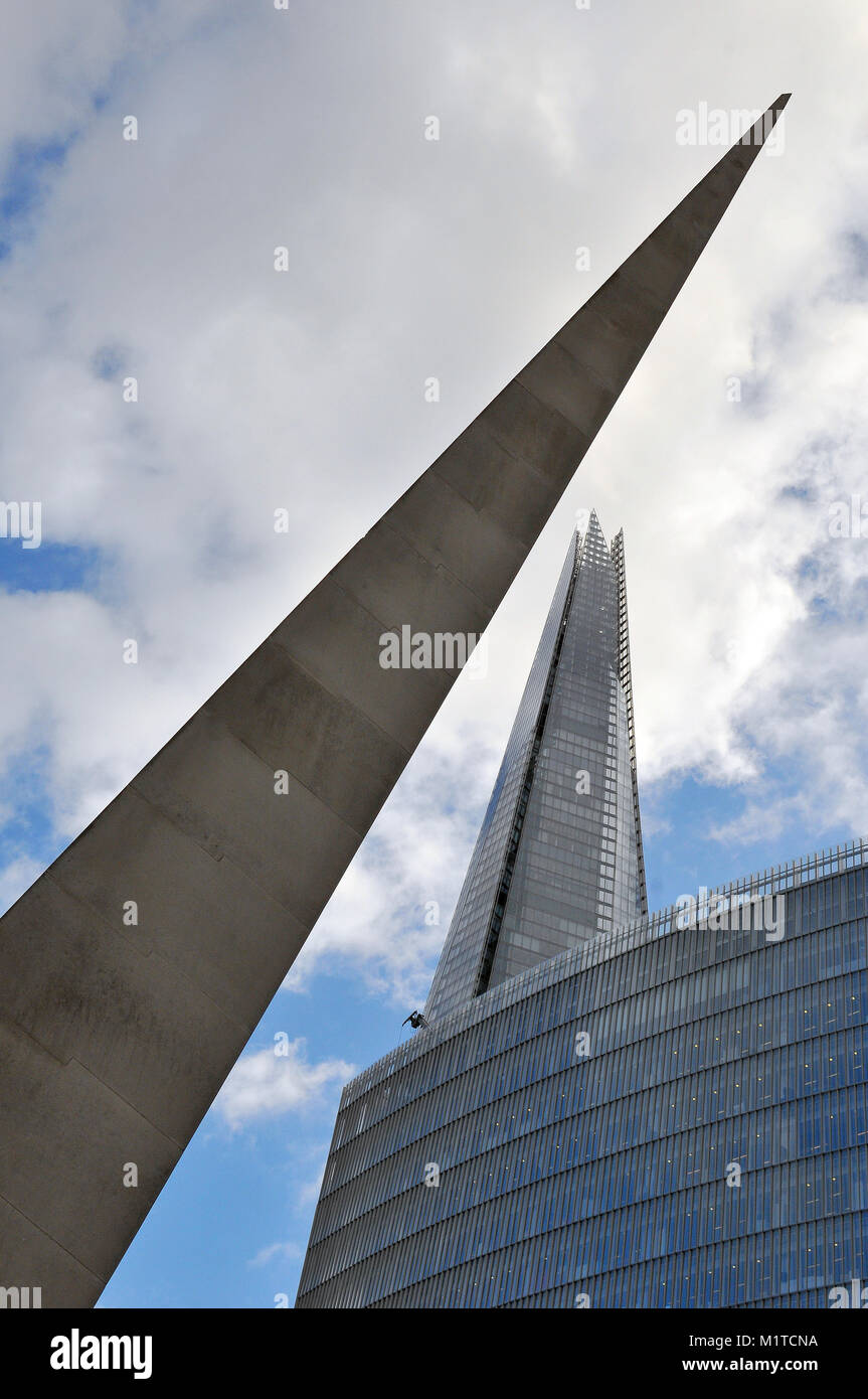 the Southwark needle sculpture with the shard and news building in an ...