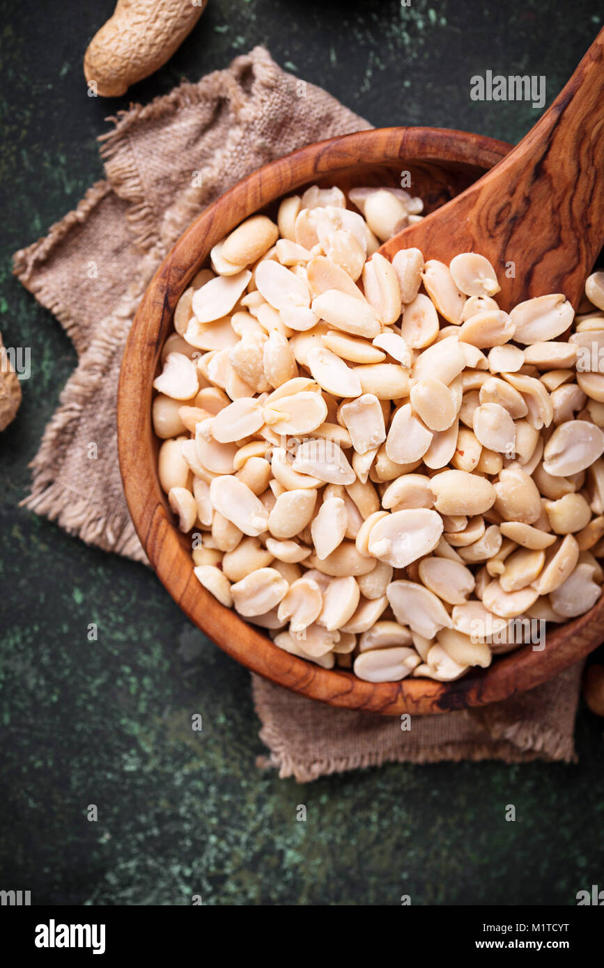 Raw peeled peanuts on bowl. Top view Stock Photo - Alamy