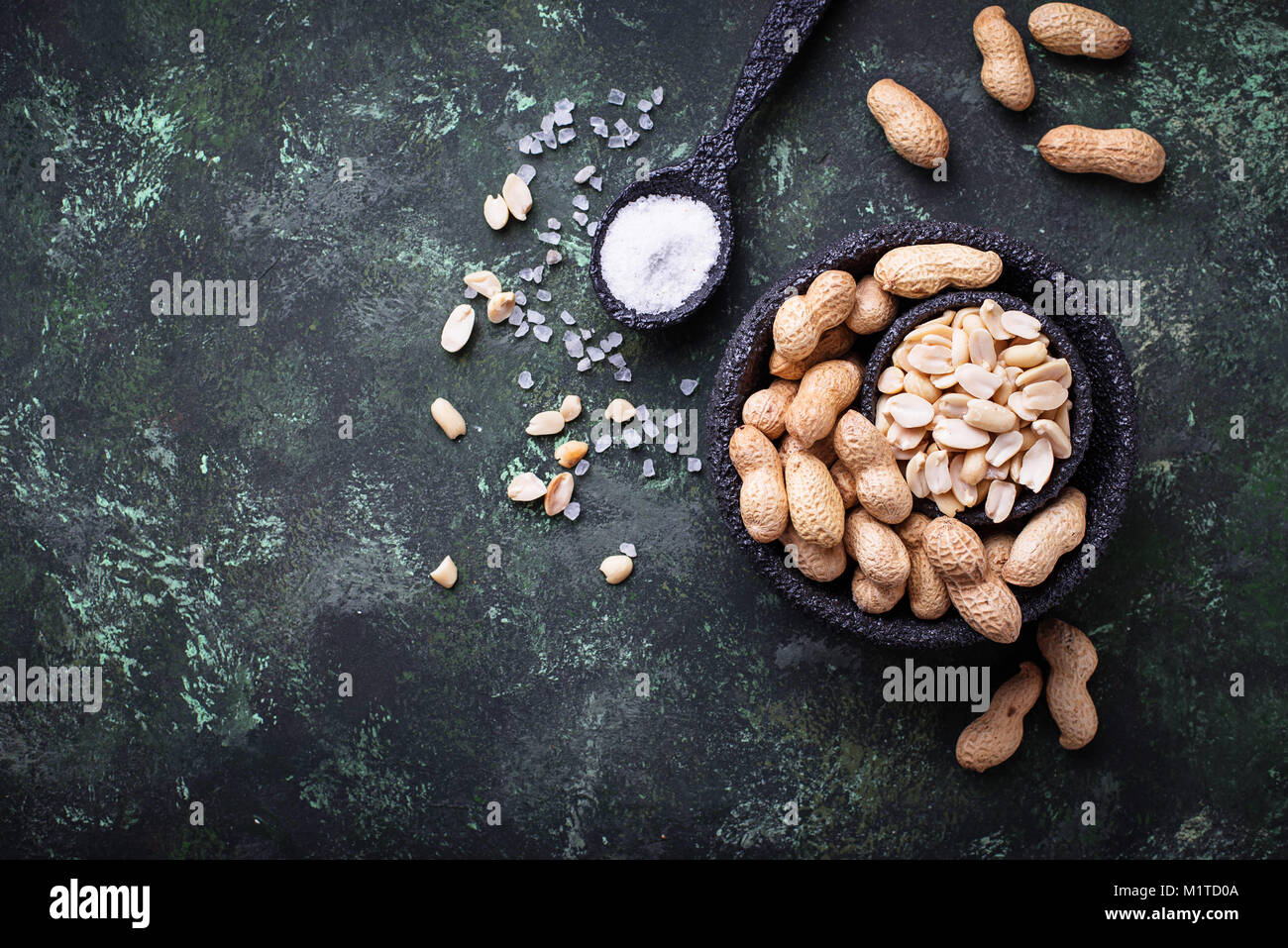 Raw peeled peanuts on bowl. Top view Stock Photo - Alamy