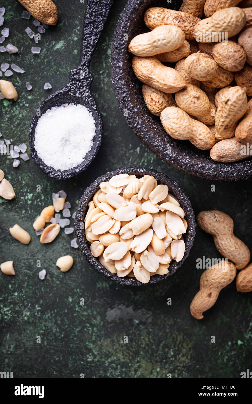 Raw peeled peanuts on bowl. Top view Stock Photo - Alamy