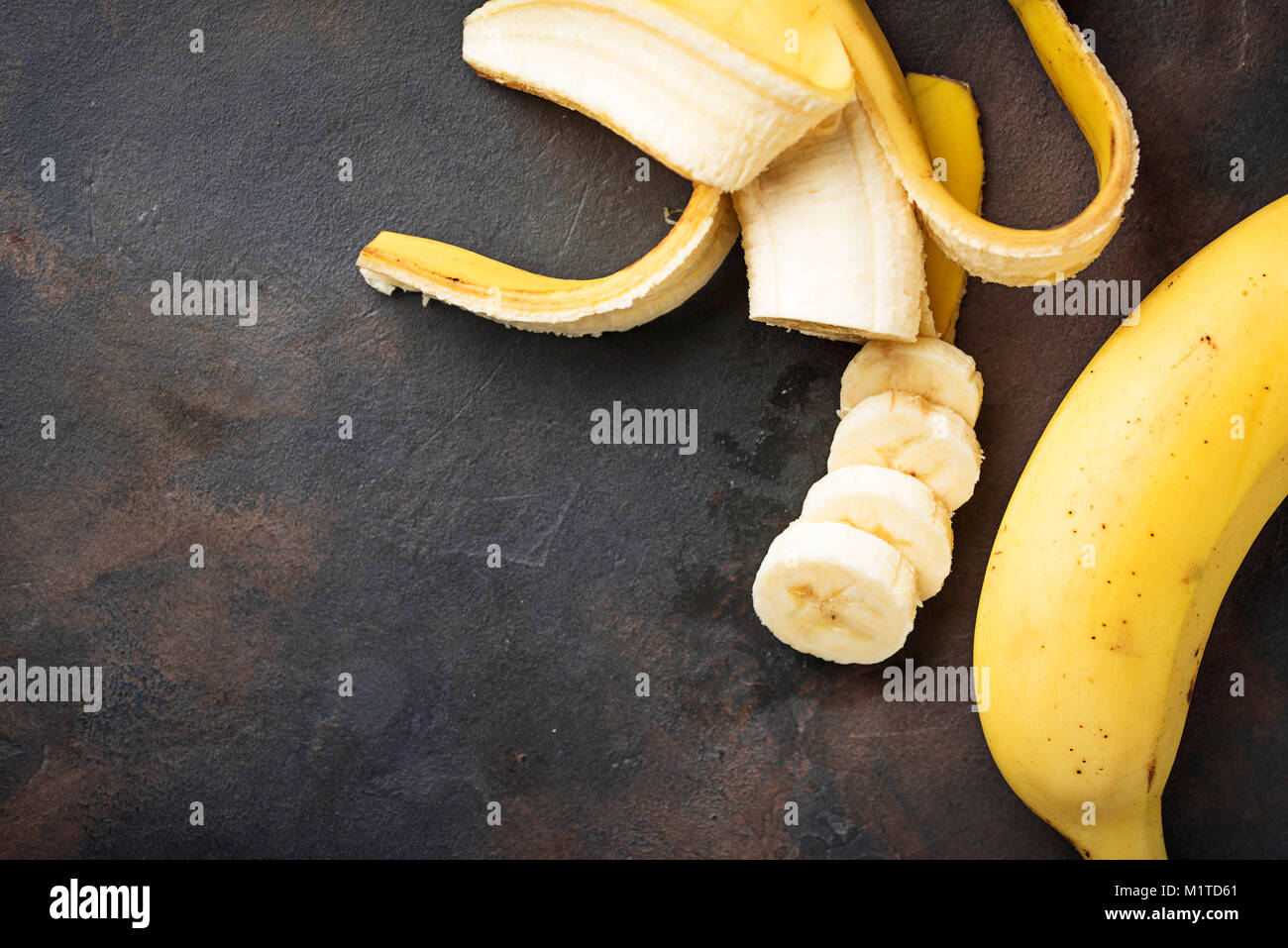 Fresh sliced banana on dark background. Top view Stock Photo - Alamy