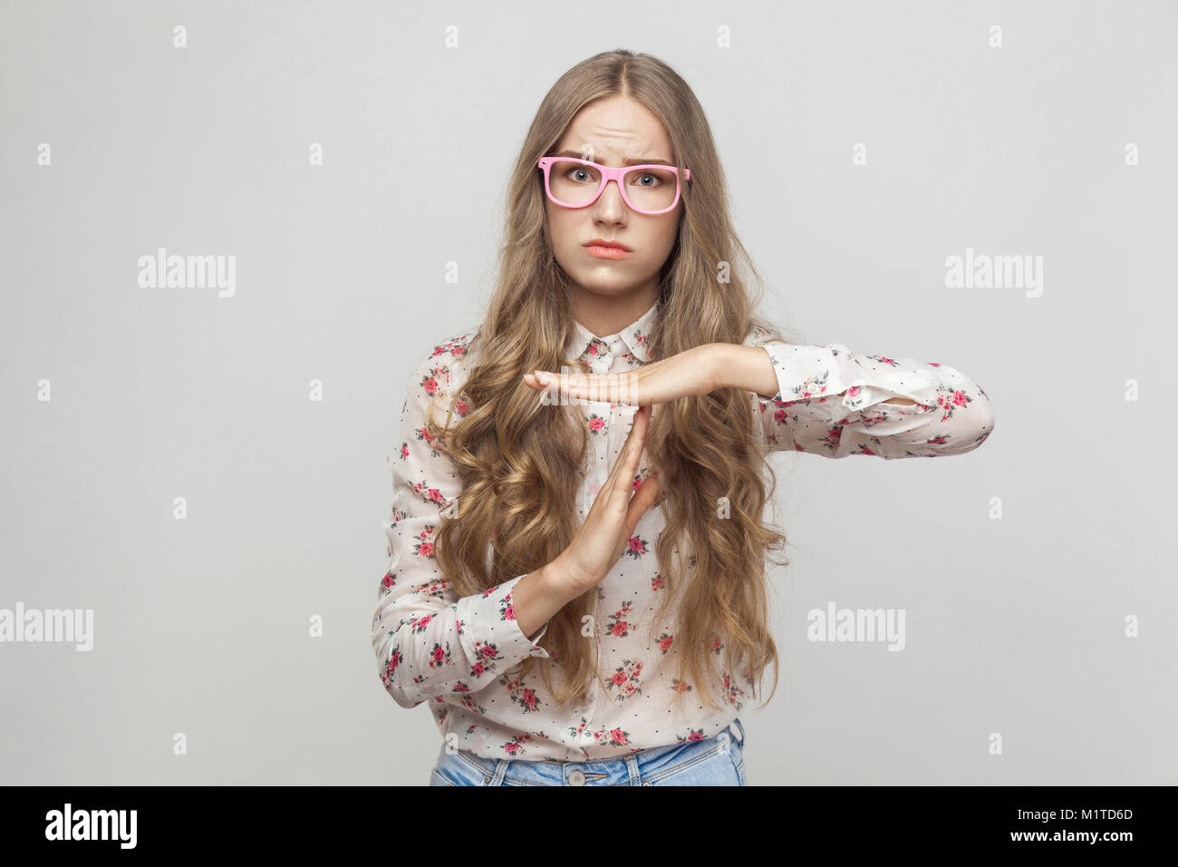 Time out! Please, i need a pause. Body language. Studio shot, gray ...
