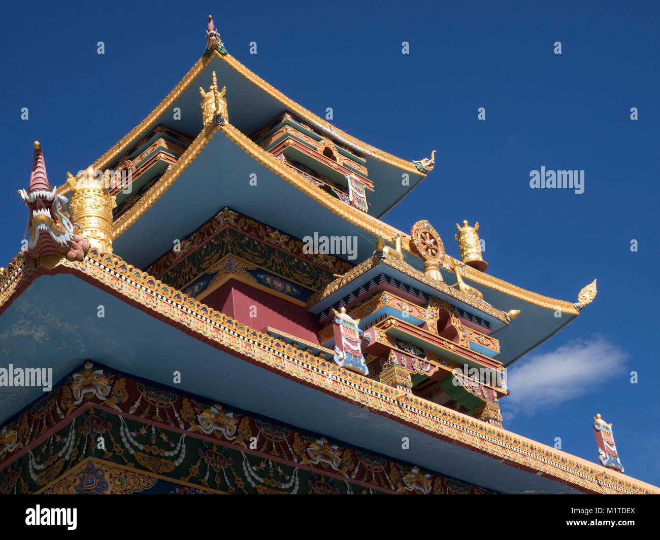 Roof of a Buddhist monastery with traditional Tibetan decorations and ...