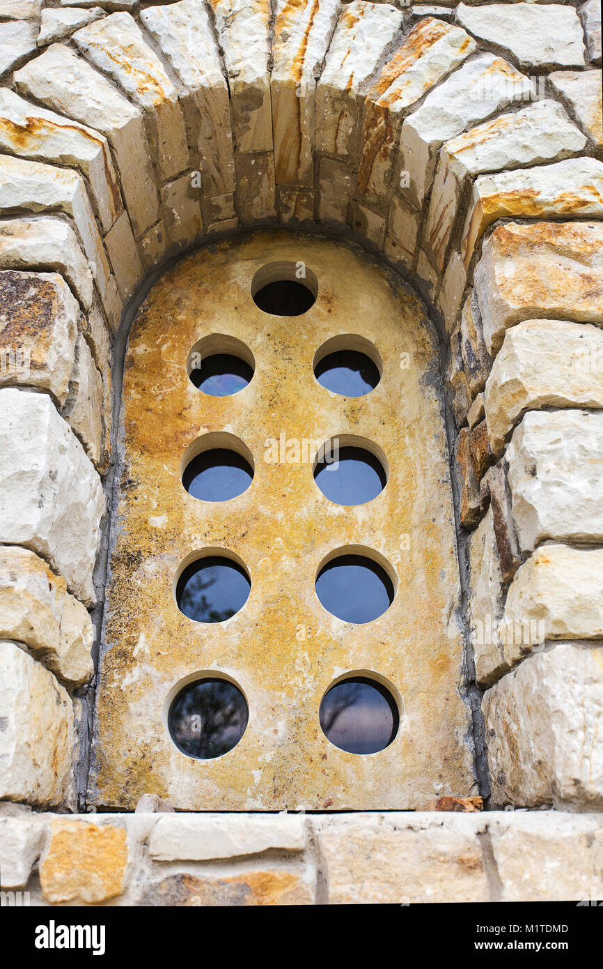 old stone window with round holes Stock Photo - Alamy