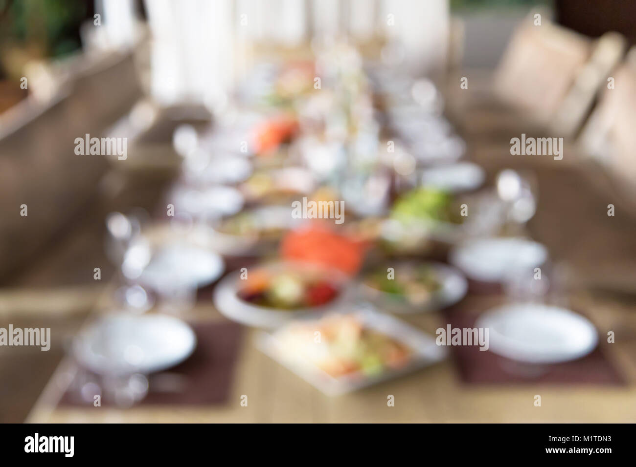 blurred served table in restaurant, background Stock Photo - Alamy
