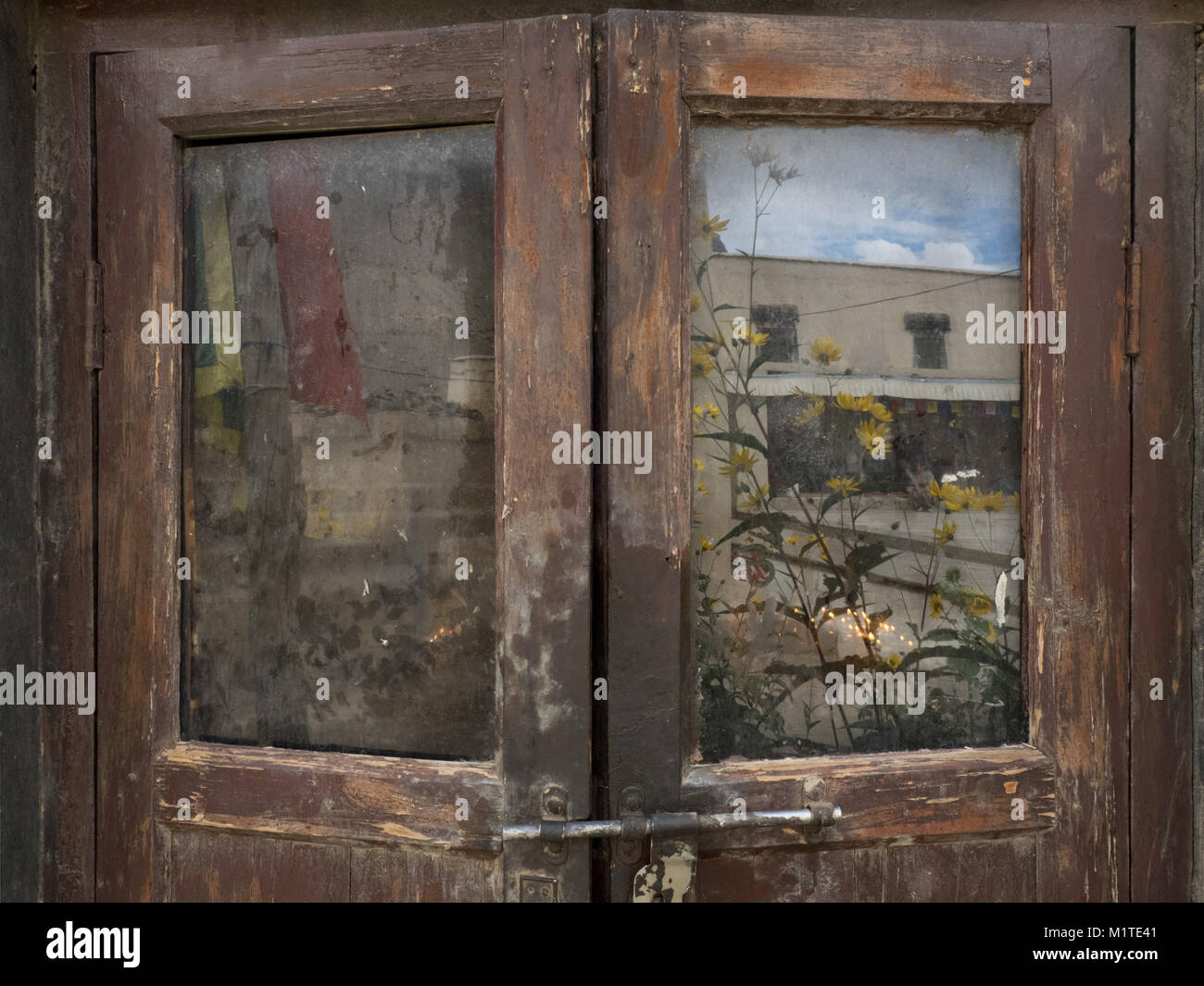 Ancient wooden door in the Buddhist monastery of Tabo, the glass ...