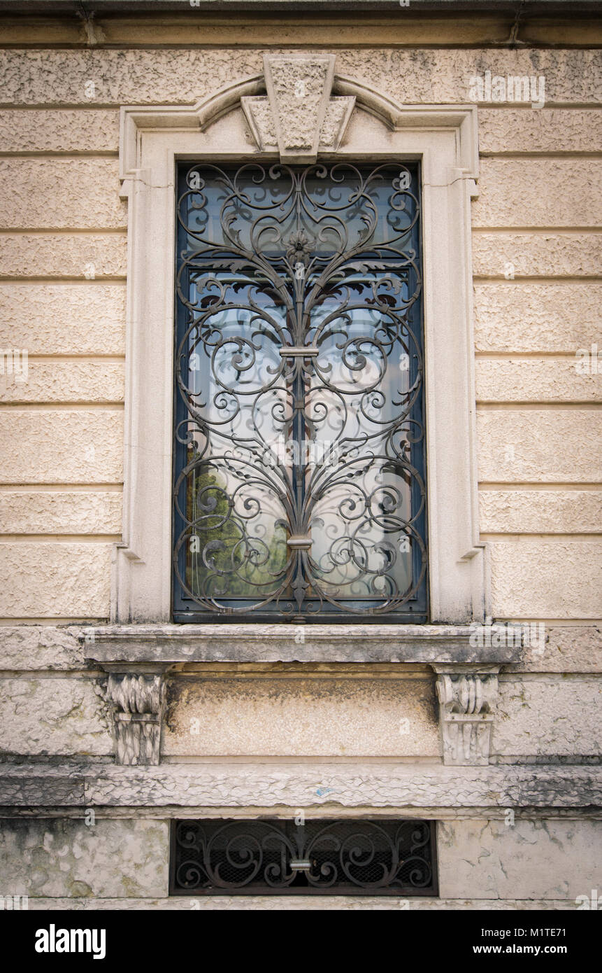 Window of an ancient Italian villa with artistic iron grill handmade ...