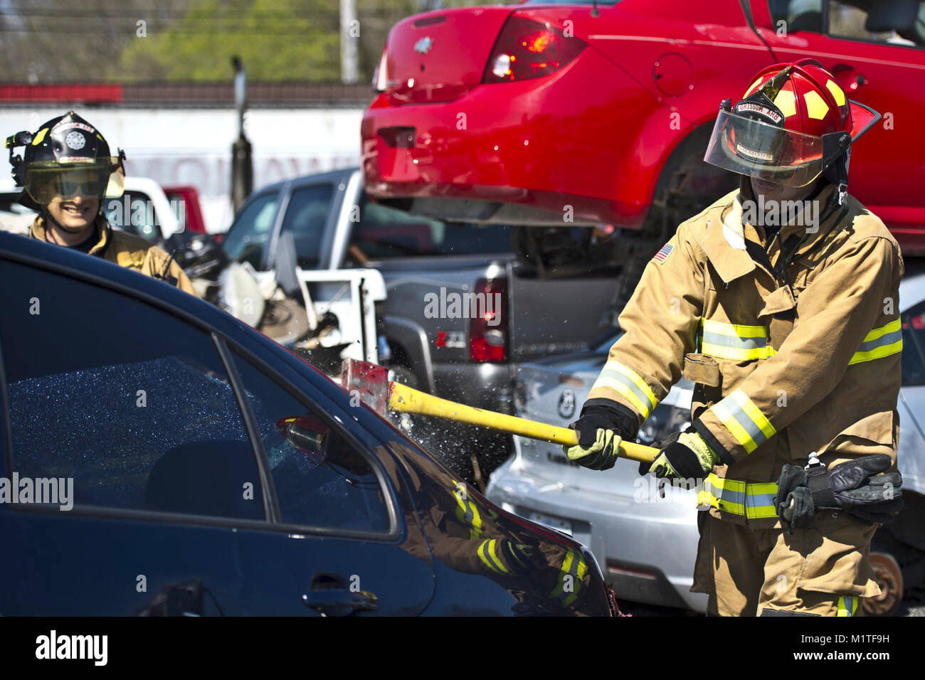 Gary Purcell and Robert Jacobs, Grissom firefighters, break the windows ...