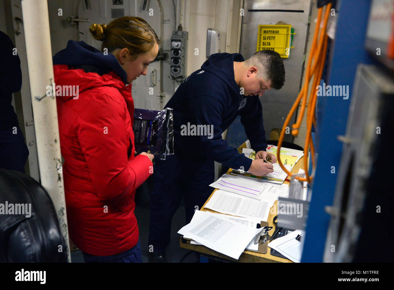 Petty Officer 3rd Class John Hammett, a storekeeper aboard the Coast ...