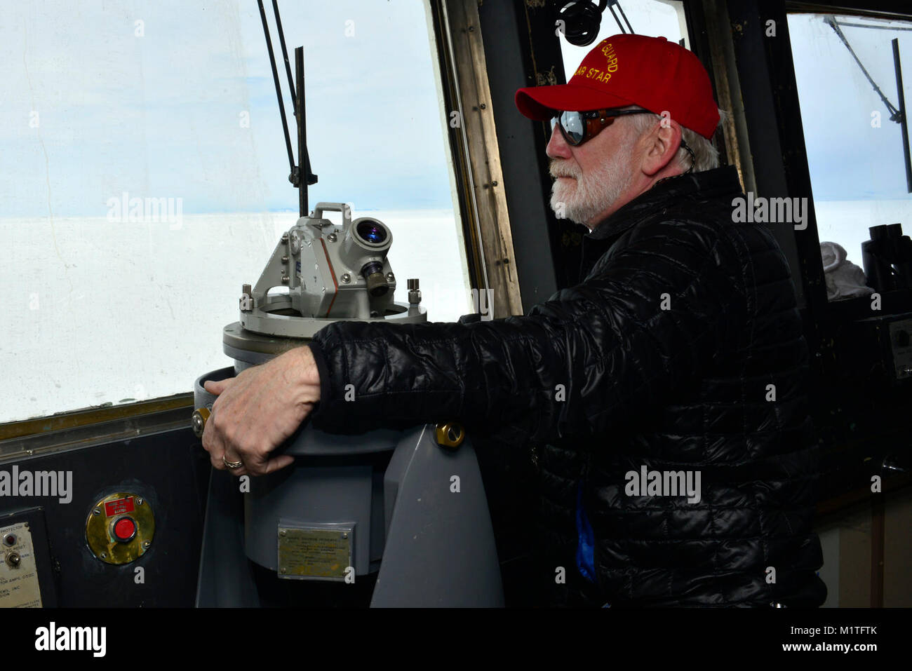 Capt. David Snider of the Nautical Institute looks on as the Coast ...