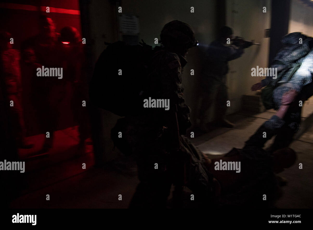 U.S. Army combat medics with the West Virginia Army National Guard drag ...