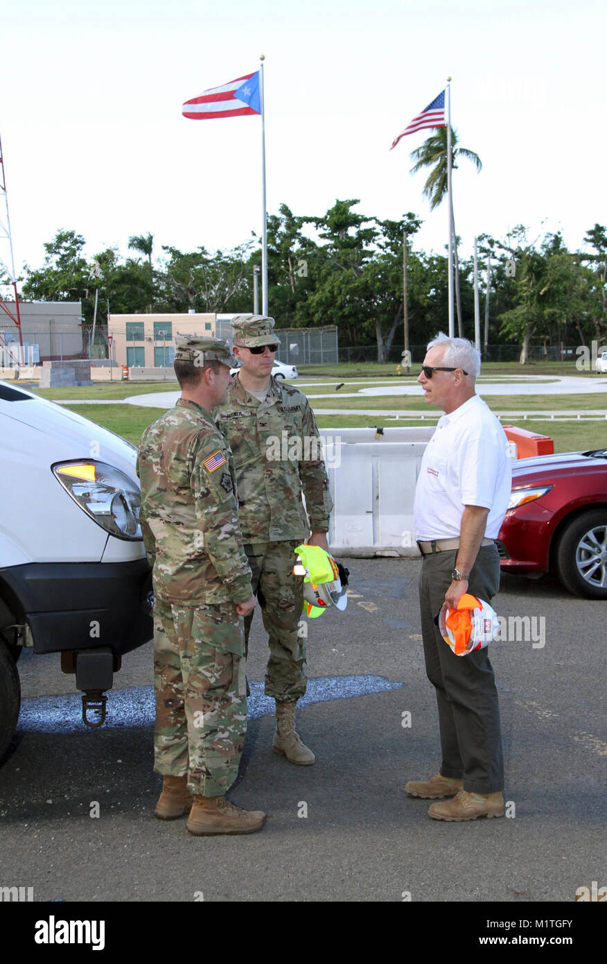 With United States and Commonwealth of Puerto Rico flags waving from ...