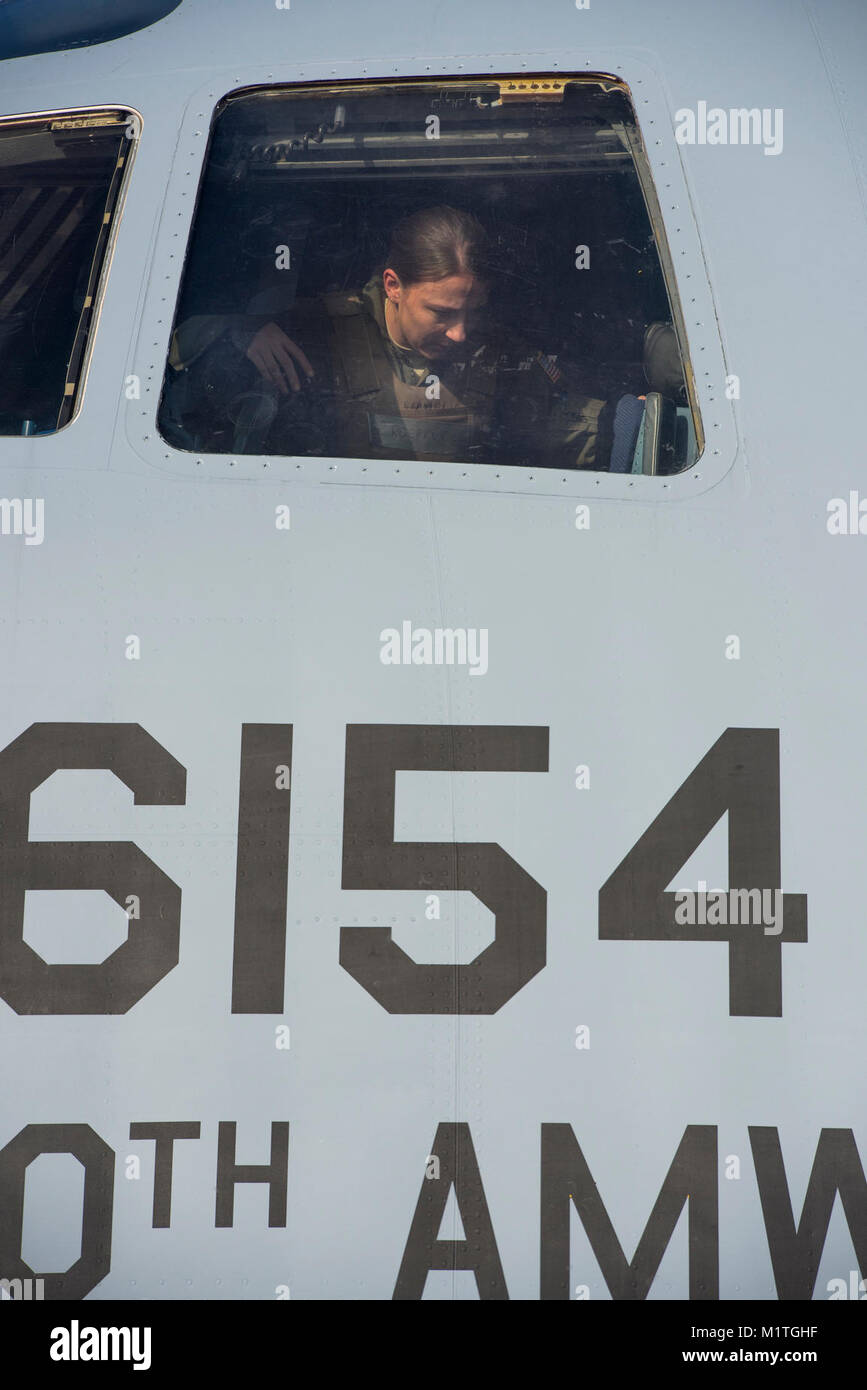 An aircrew member assigned to the 60th Operations Group dons Mission ...