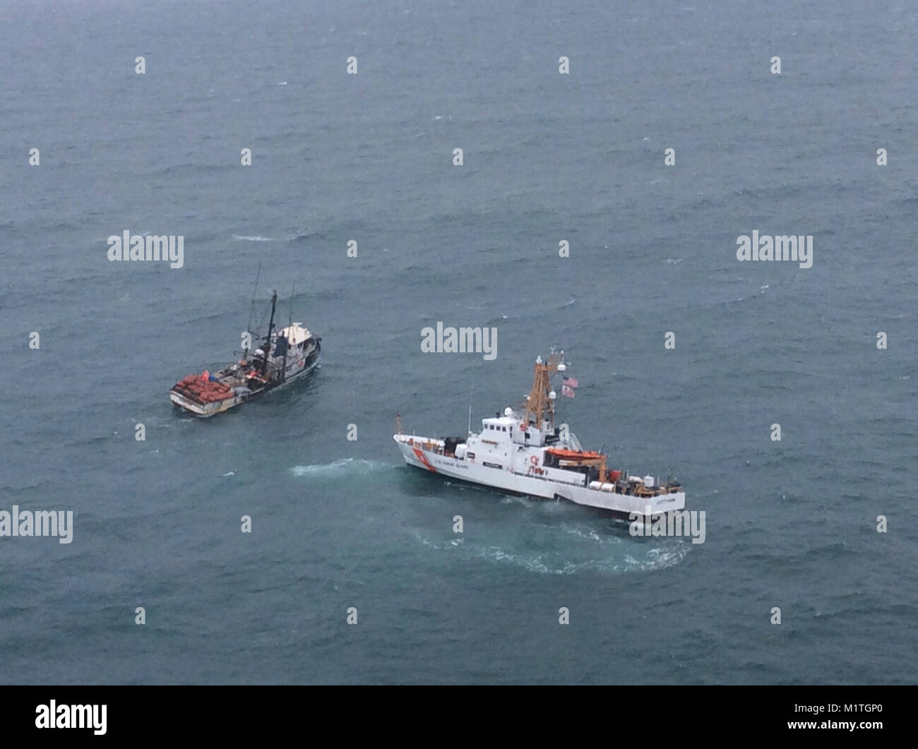 The crew aboard the Coast Guard Cutter Cuttyhunk is on scene with the ...