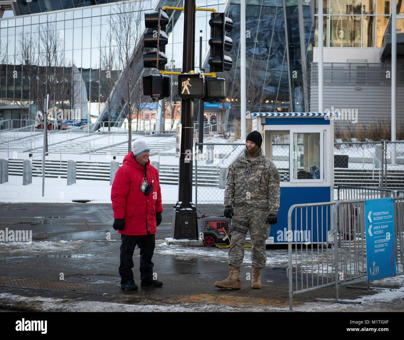 Spc. Derek Harren with the Minnesota Army National Guard talks with a ...