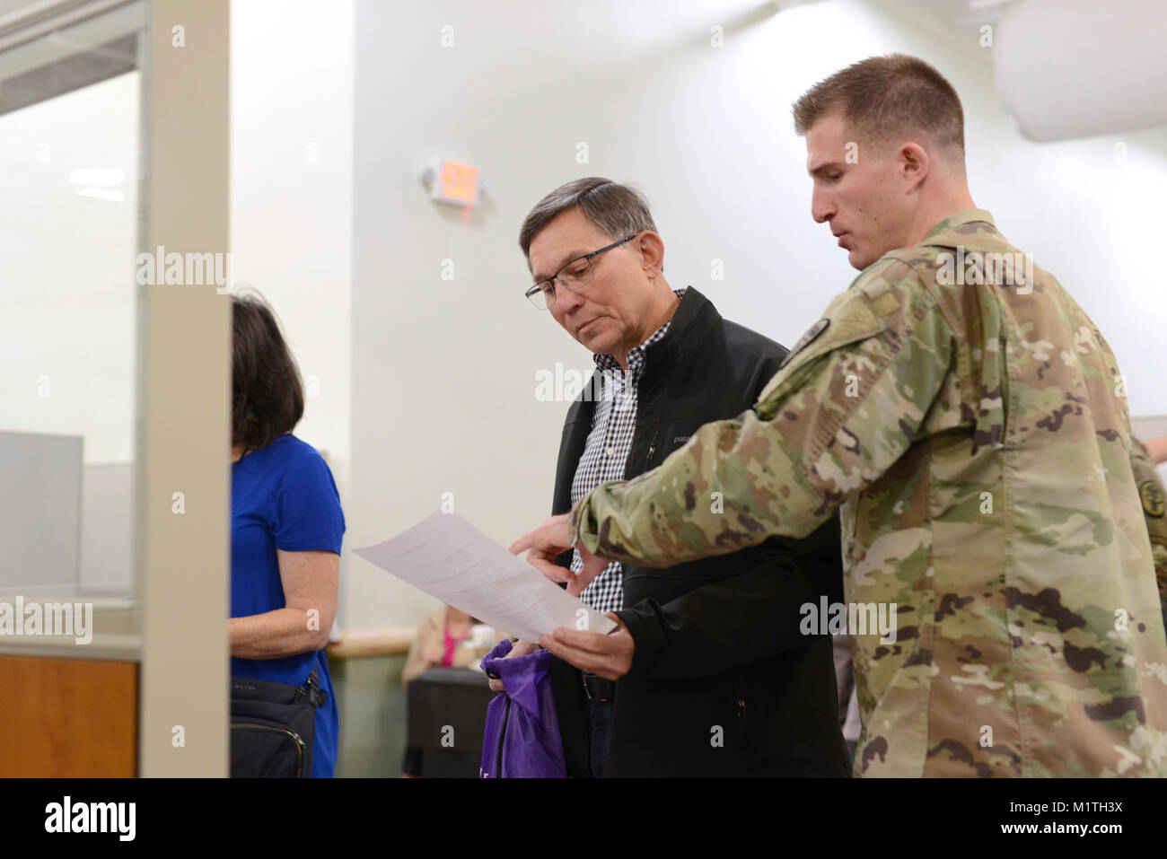 David Winter speaks with Capt. Leslie Armstrong, chief, outpatient ...