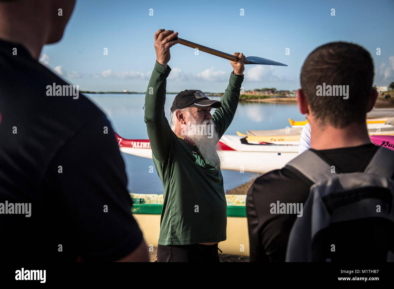 Coach and steersman of the Ka Mamala Hoe Canoe Club demonstrates proper ...