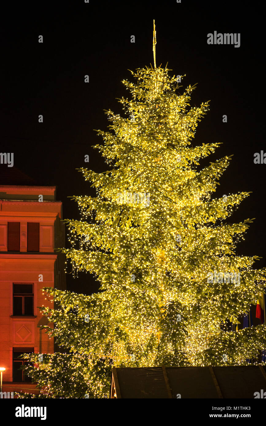 Christmas market in city center. Big, decorated Christmas tree with ...