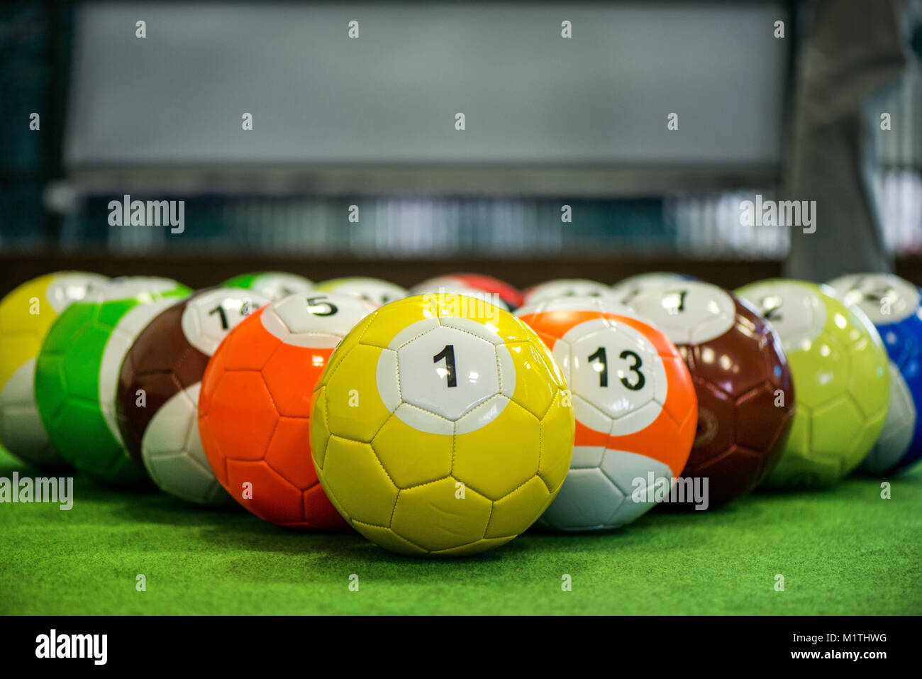 Shot of foot pool balls standing on green table. Foot Pool is the ...