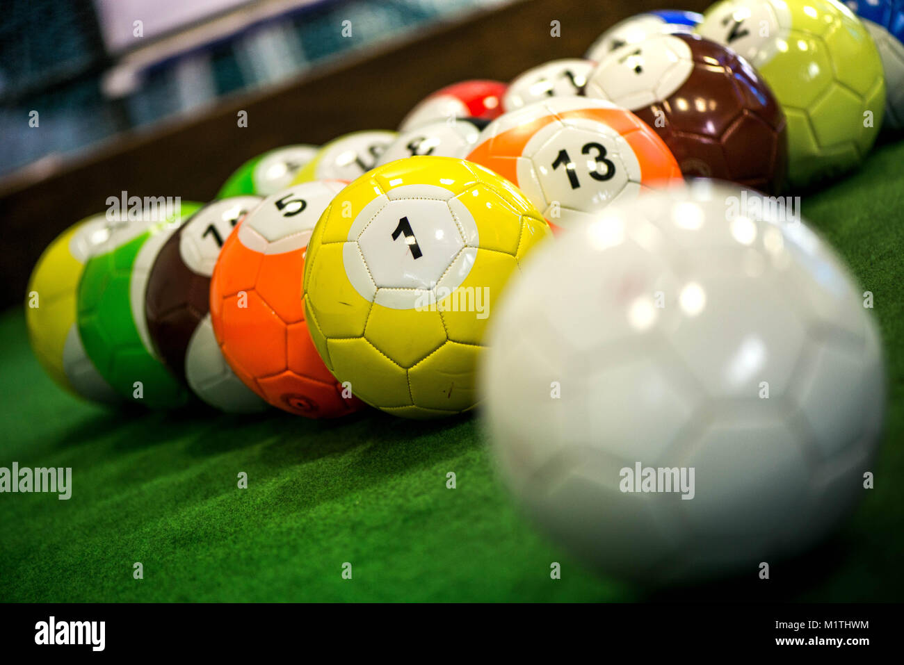 Shot of foot pool balls standing on green table. Foot Pool is the ...