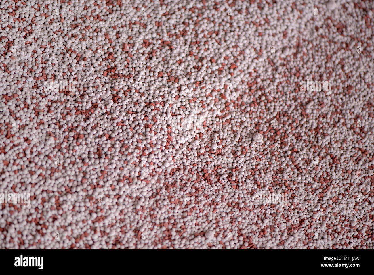 Shot of mixed chemical, artificial nitrogen plant fertilizer granules ...